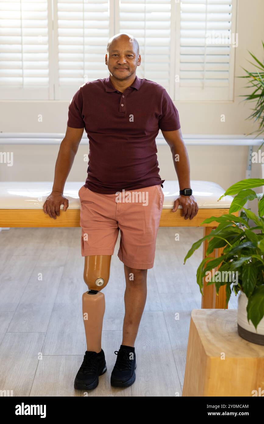Man with prosthetic leg standing confidently in modern prosthetic ...