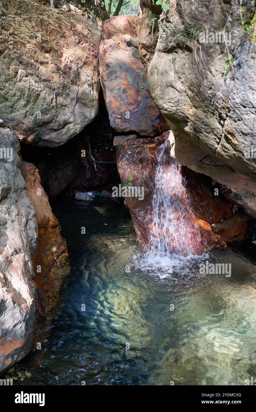 Clear water river in a gorge with huge boulders, forming rapids and ...