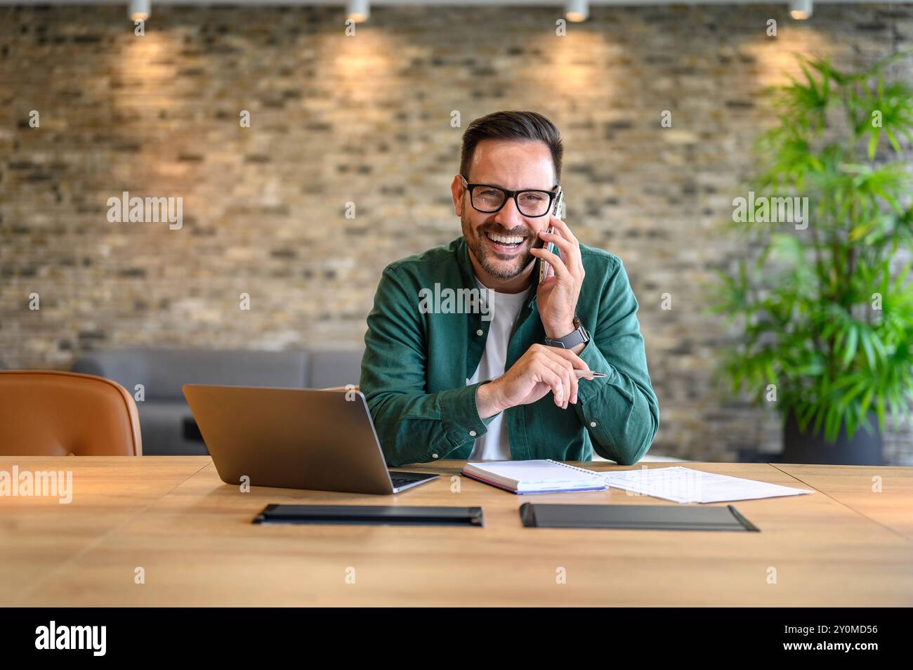 Portrait of young smiling cheerful businessman entrepreneur in casual ...