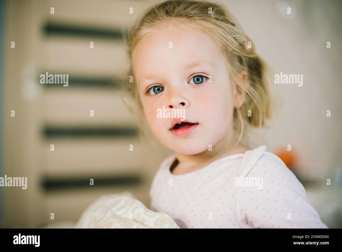 girl child waking up in the morning having fun and playing in bed Stock ...