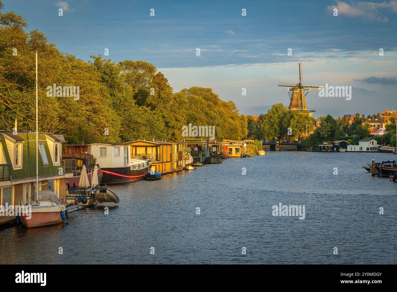Cityscape of Amsterdam, waterfront with traditional dutch windmill De ...