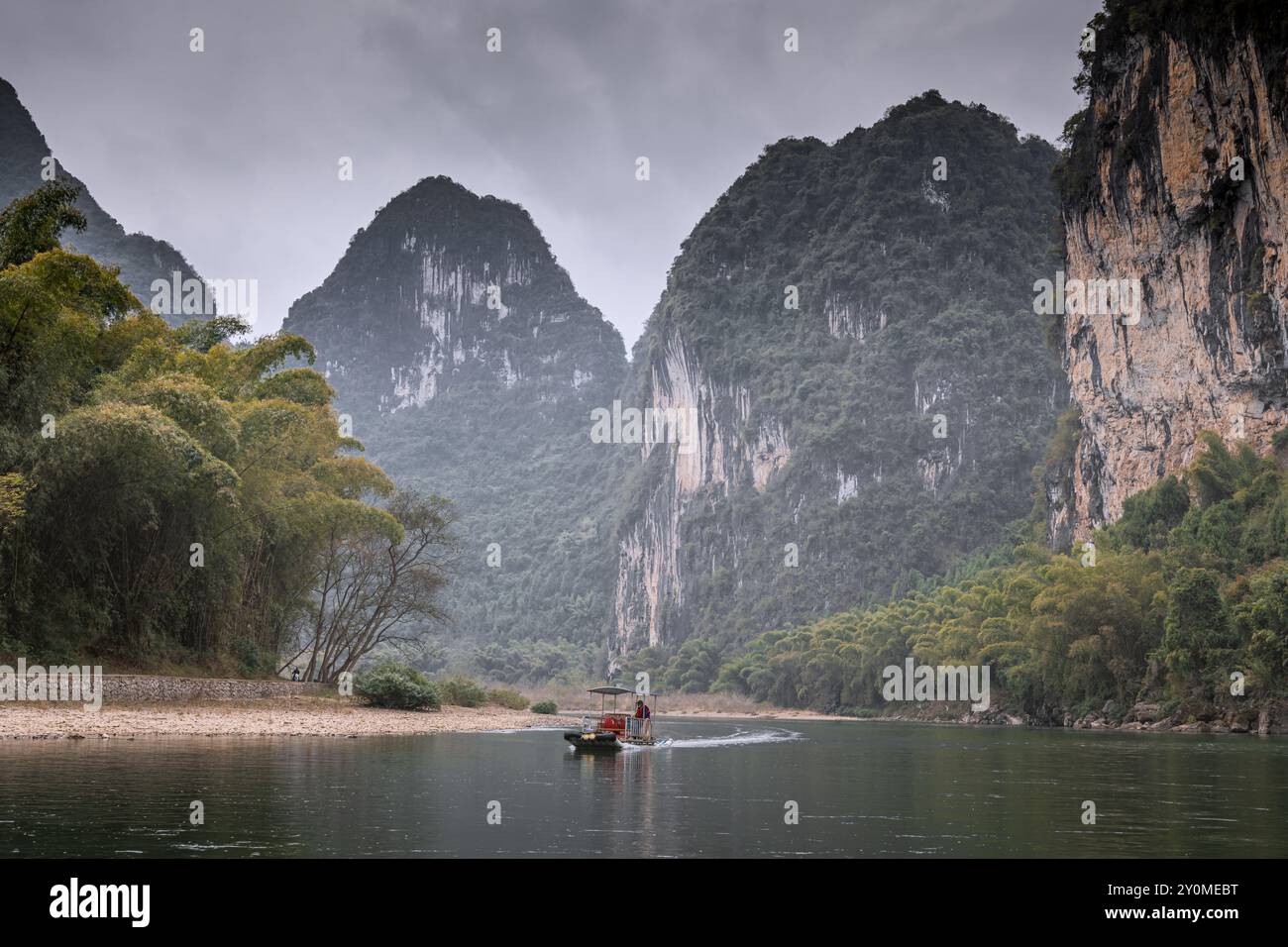 Bamboo and the limestone mountains at the Li river around Xing Ping ...