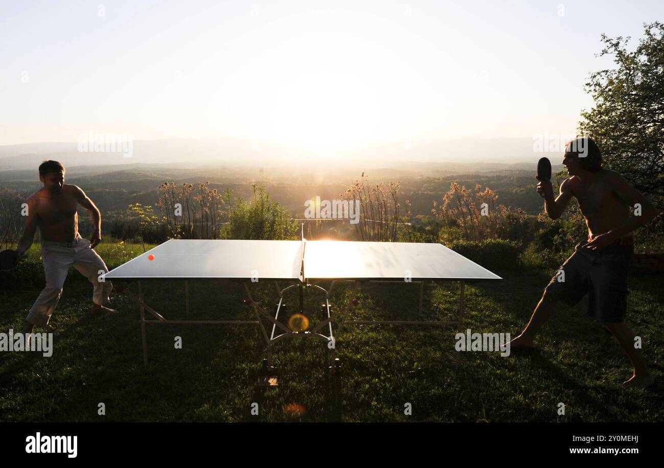 playing a game of ping pong on a table tennis table playing table ...