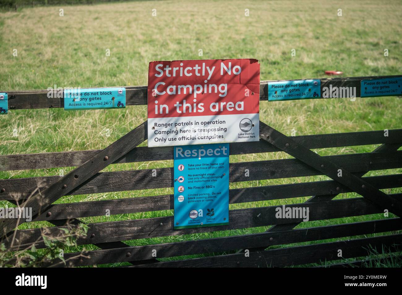 Signs warning of trespassing and no camping allowed, Lake District ...