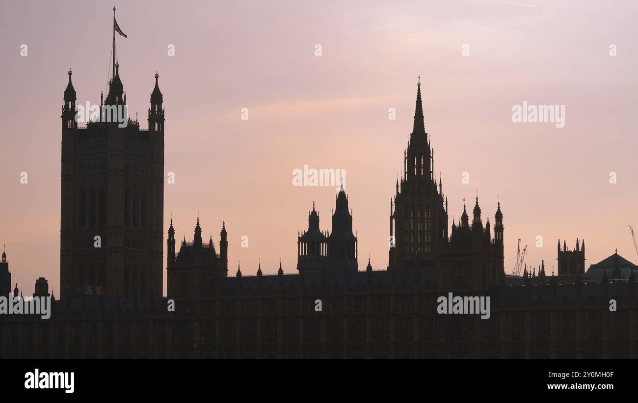Westminster towers at sunset, iconic London tourist attraction with ...