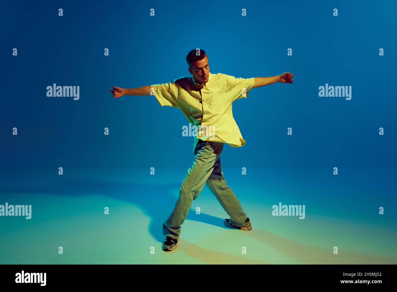 Cool guy, talented and artistic man energetically dancing hip-hop ...