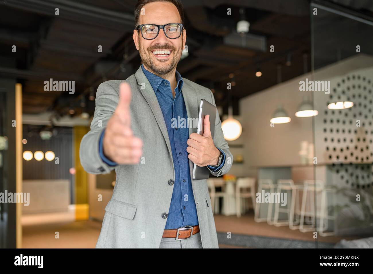 Portrait of successful male CEO with wireless computer smiling and ...