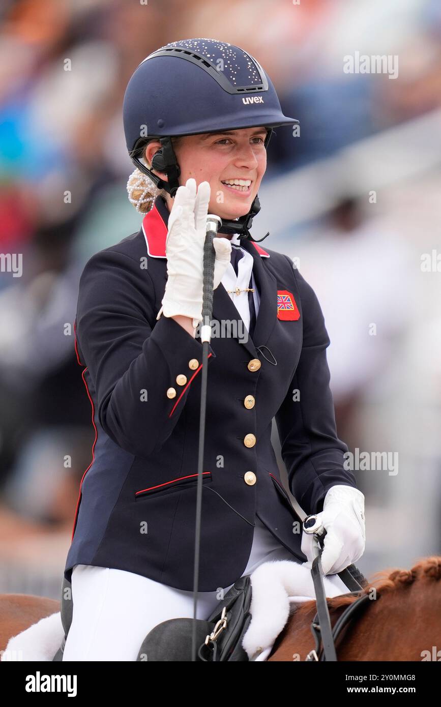 Great Britain's Georgia Wilson waves whilst riding Sakura after the ...