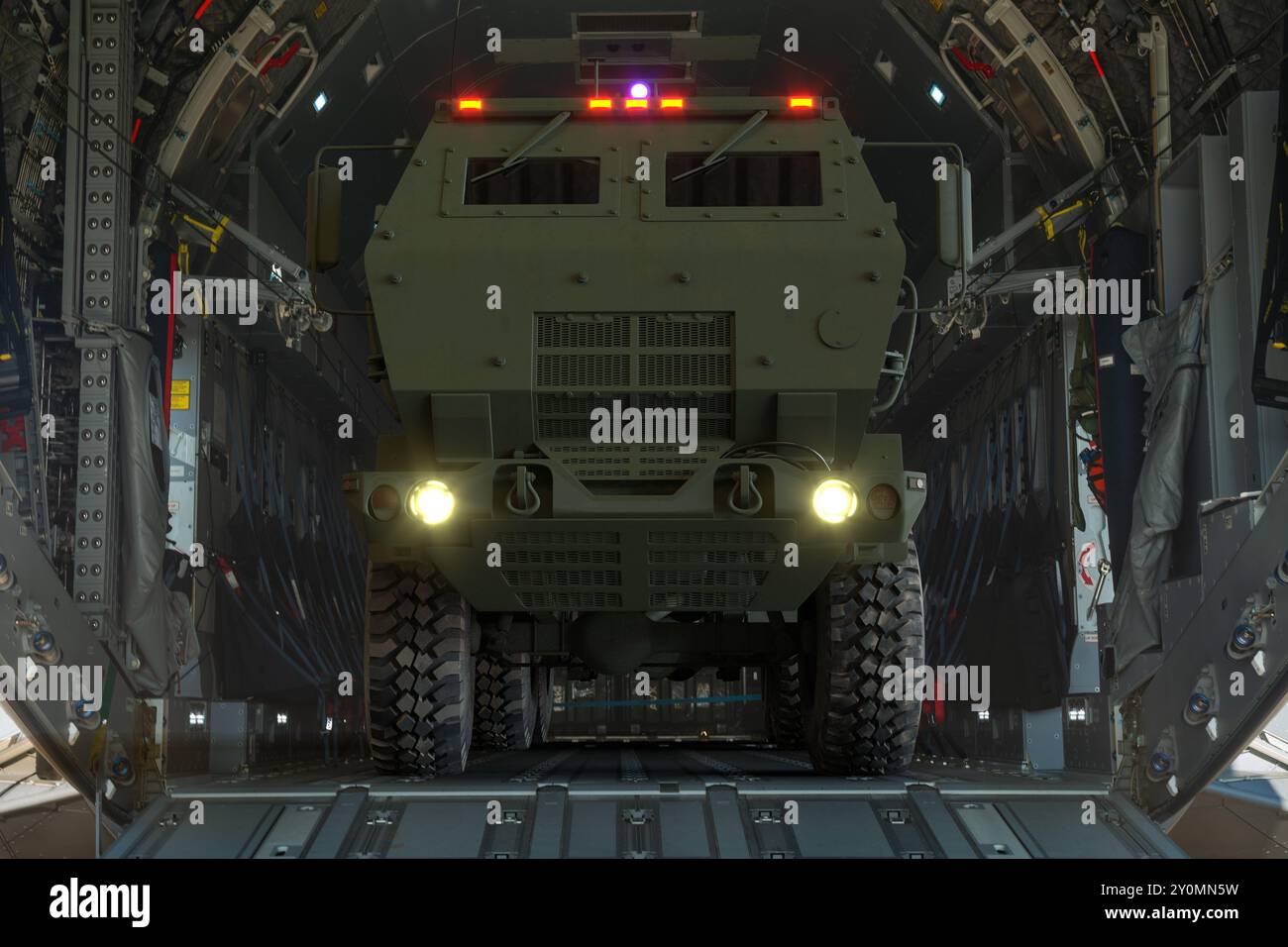 High mobility artillery rocket system transported aboard a transport ...