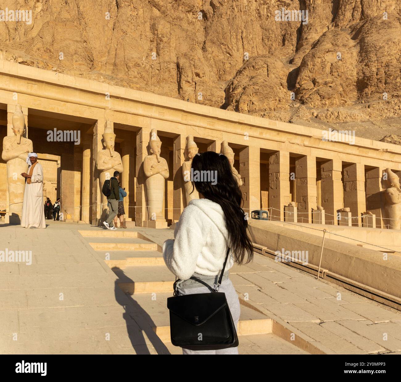 Luxor, Egypt; January 16, 2024: Woman visiting the temple of Hatshepsut ...