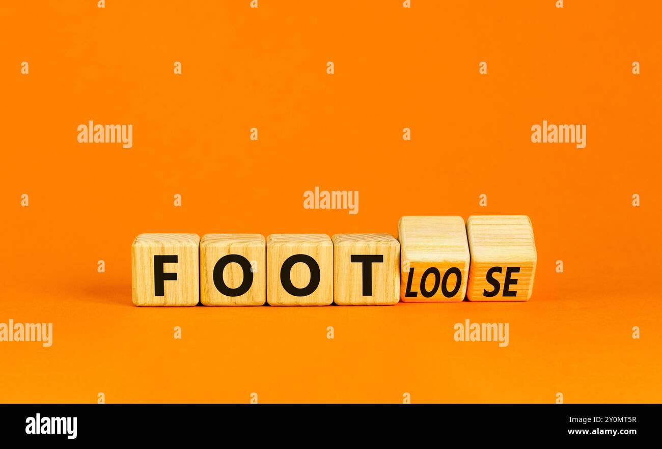 Foot or footloose symbol. Businessman turns wooden cubes and changes ...