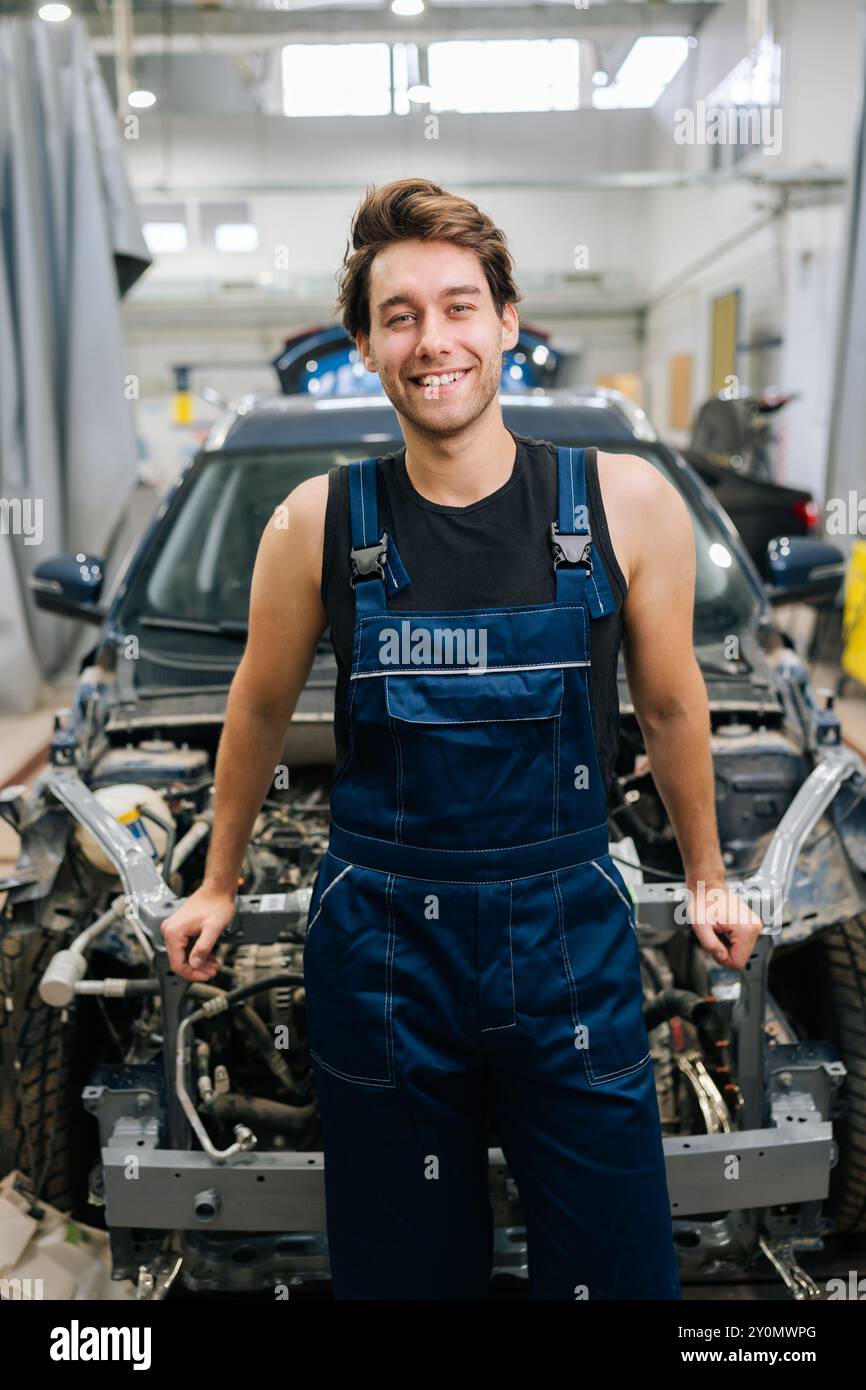 Positive handsome young auto mechanic hi-res stock photography and ...
