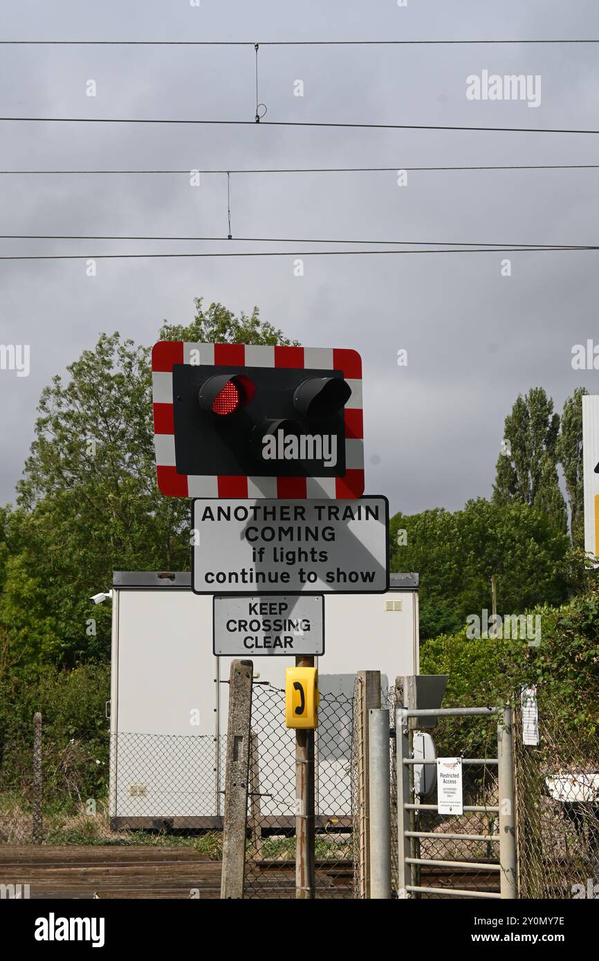 red light flashing at level crossing Stock Photo - Alamy