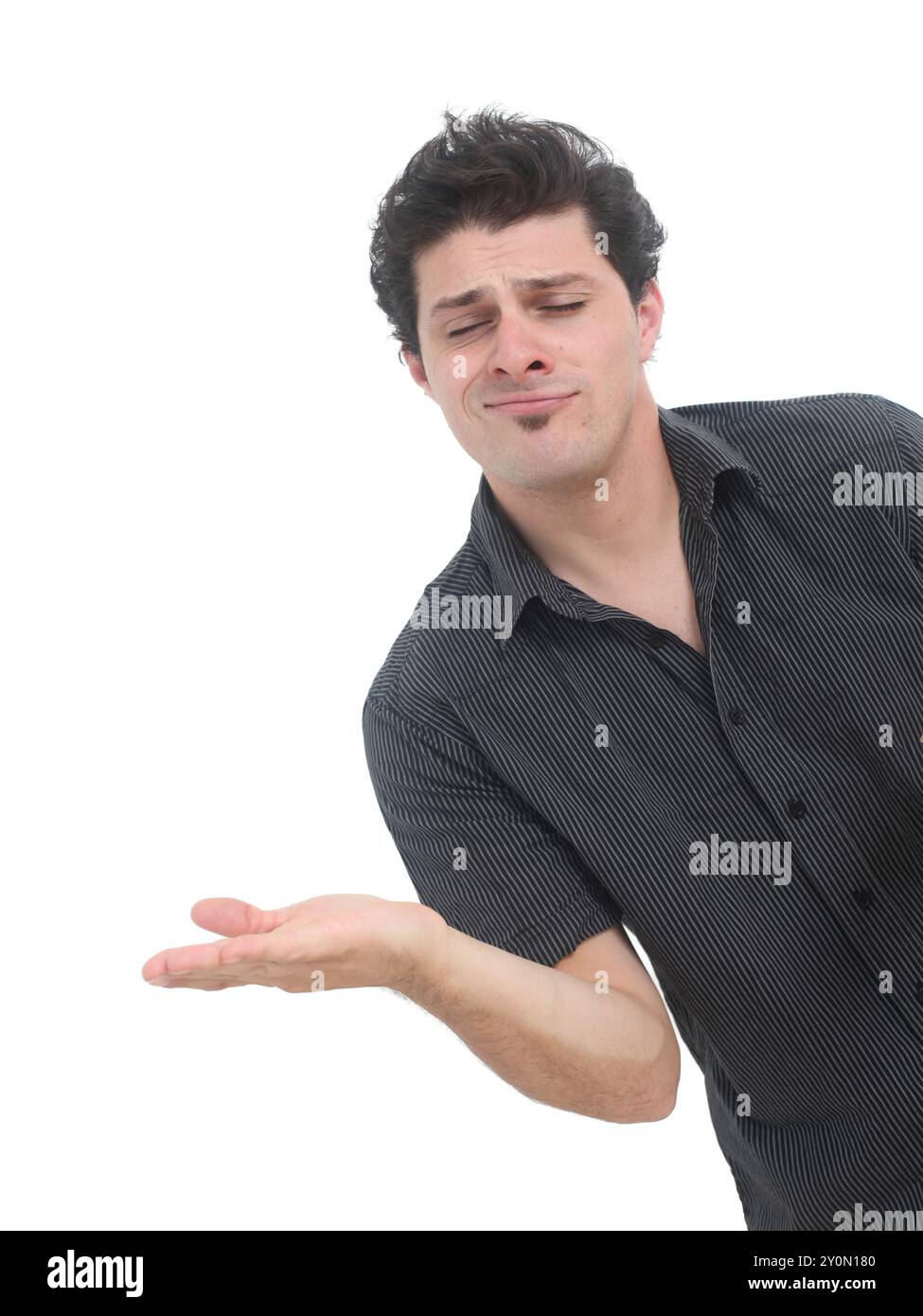 confident cheerful young man showing copy space with his hand on white ...