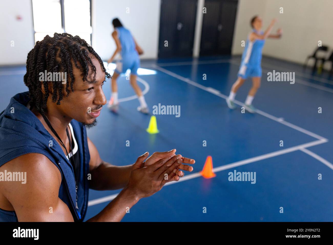 Encouraging female players, male african american basketball coach ...