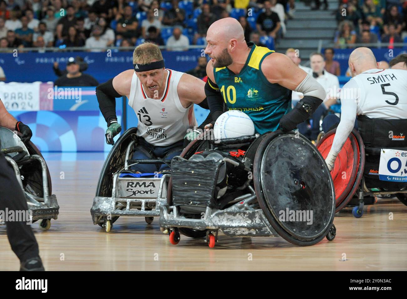 Aaron Phipps (GBR) and Chris Bond (AUS) compete in the Wheelchair Rugby ...