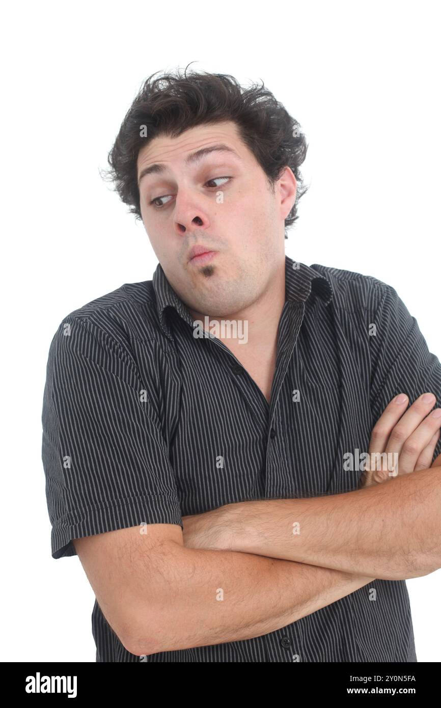 young man with clueless face expression playing innocent on white ...