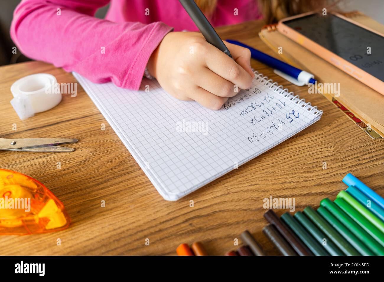 Child writing mathematical exercises hi-res stock photography and ...