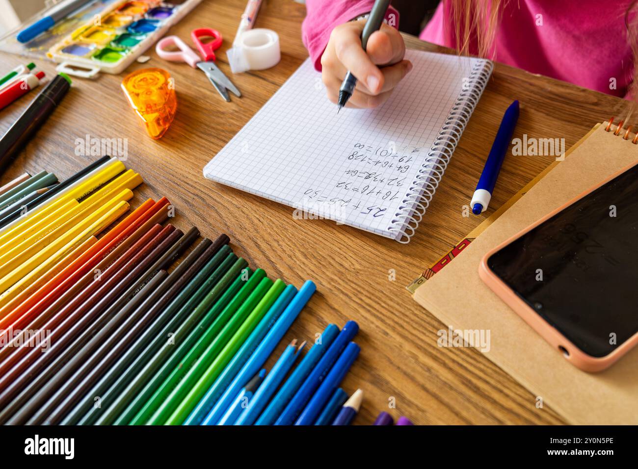 Child solving equation notebook hi-res stock photography and images - Alamy