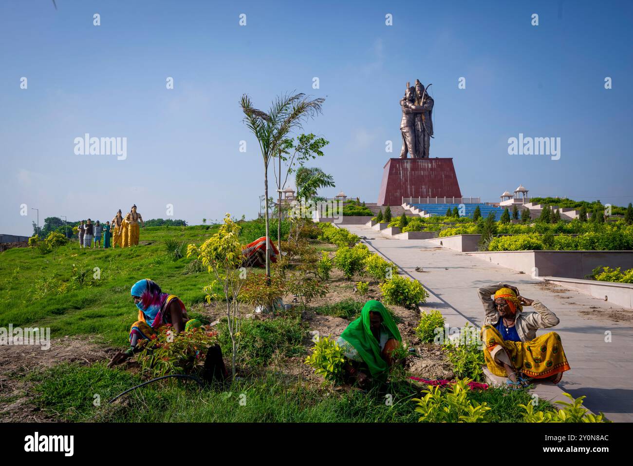 Indian laborers work in front of a statue of Lord Ram and Nishadraj in ...