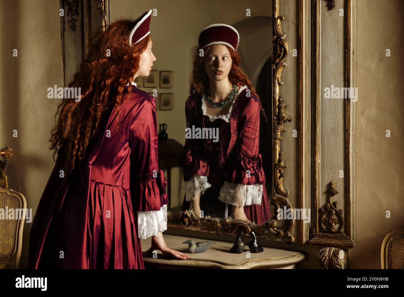 Reenactment scenes of a Renaissance queen in Tudor style posing in a ...