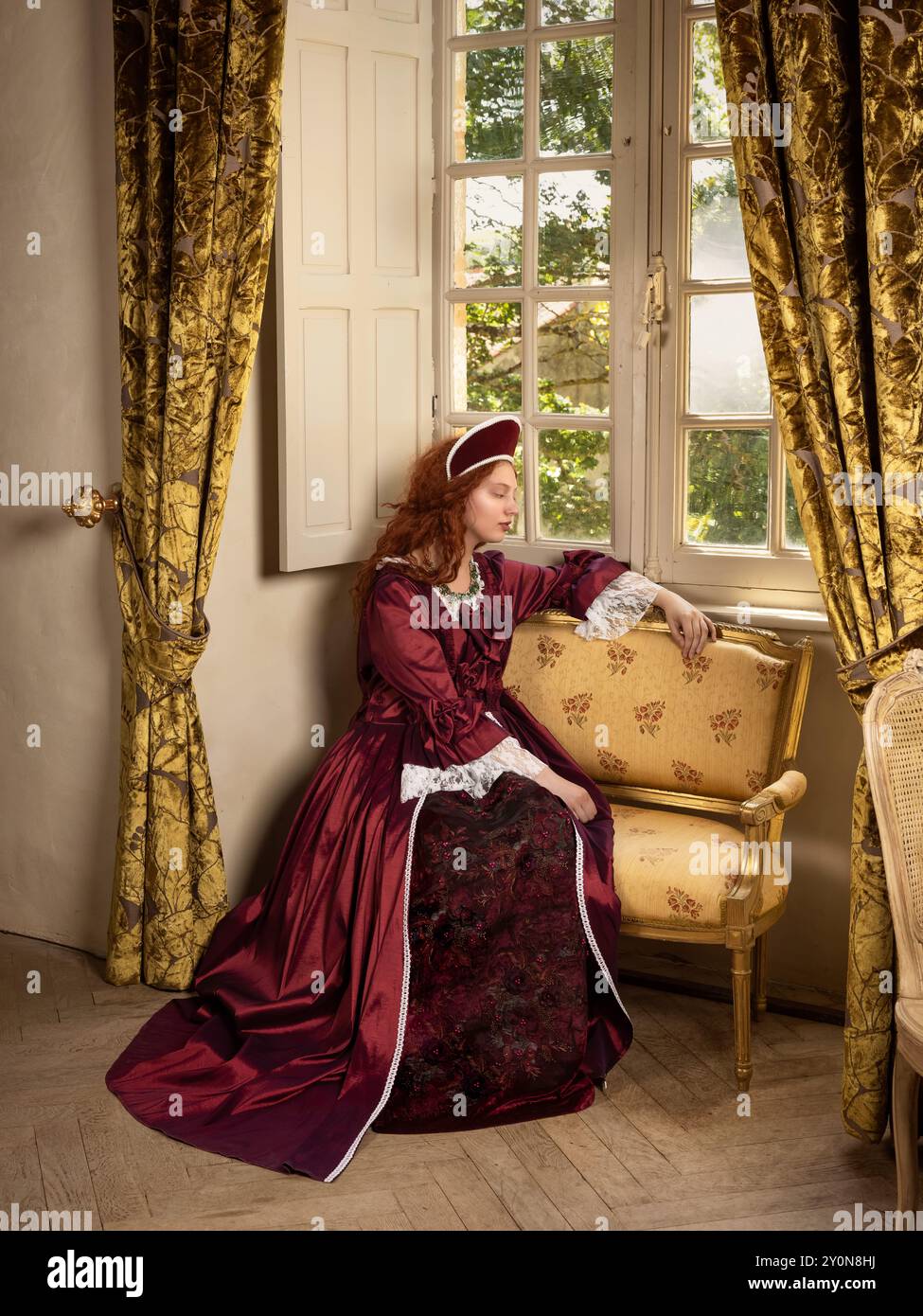 Reenactment scenes of a Renaissance queen in Tudor style posing in a ...