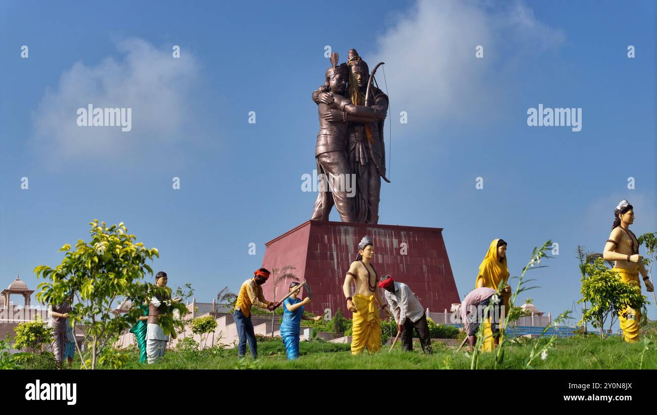 Indian laborers work in front of a statue of Lord Ram and Nishadraj in ...
