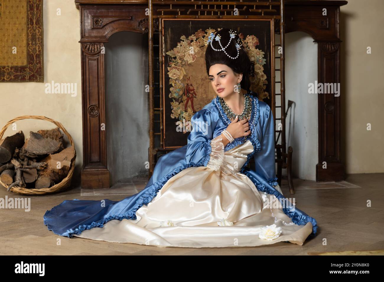 Beautiful young woman dressed in rococo queen Marie Antoinette style ...