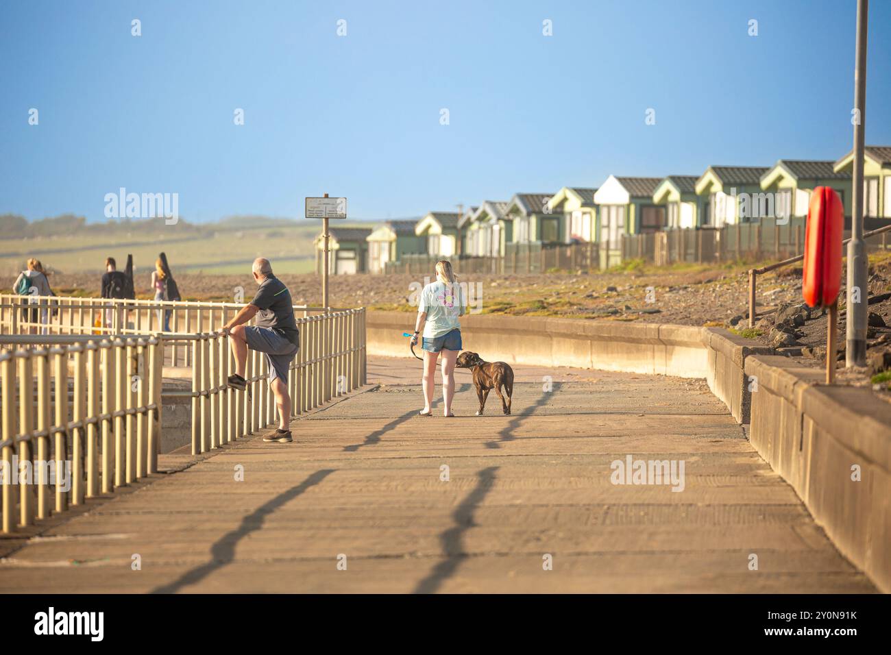 Holiday makers on the promenade at Tywyn Beach, Wales Stock Photo - Alamy