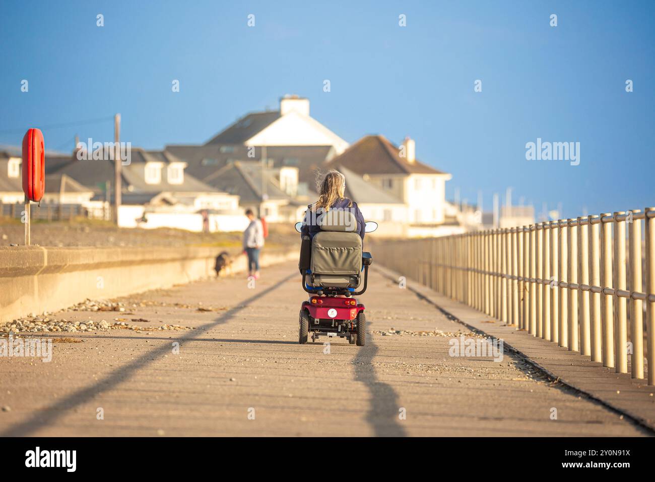 Holiday makers on the promenade at Tywyn Beach, Wales Stock Photo - Alamy