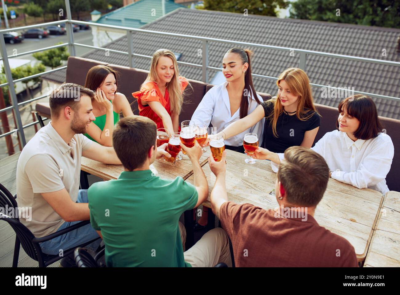 Surrounded by friends, woman in white shares heartfelt toast, as ...