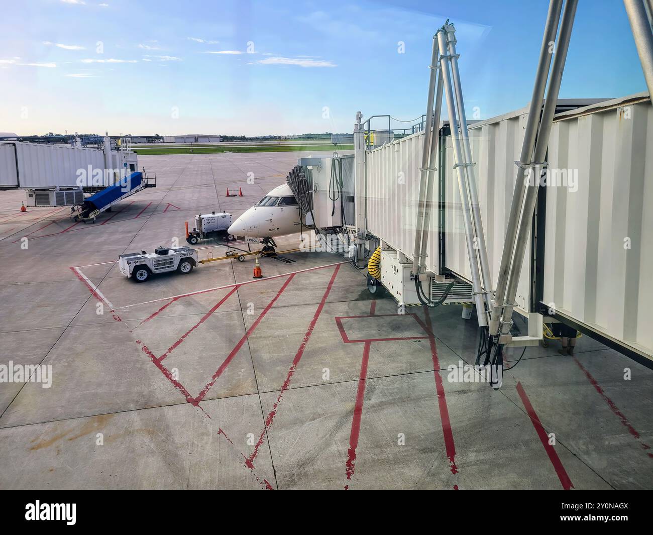 Parked Airplane at Gate with Jet Bridge from Terminal Window View Stock ...