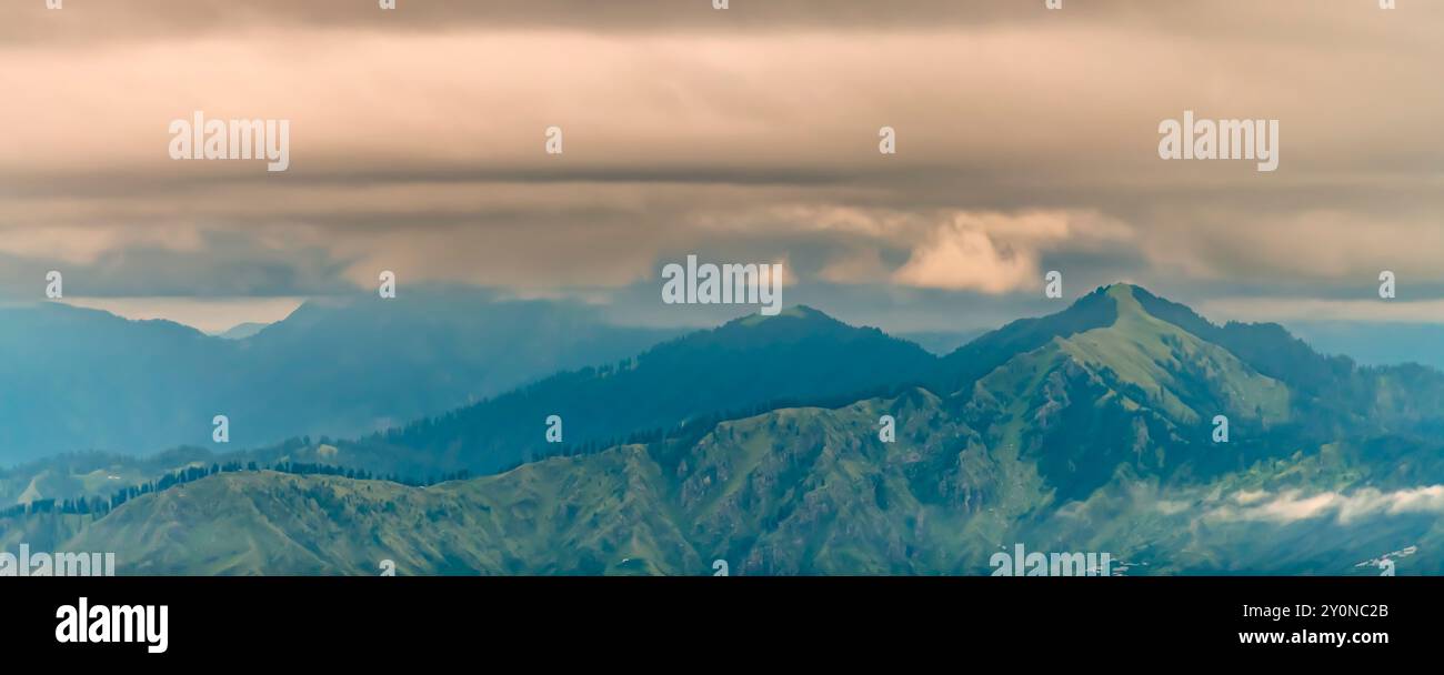 Monsoon clouds over the towering mountain ranges of the Lesser ...