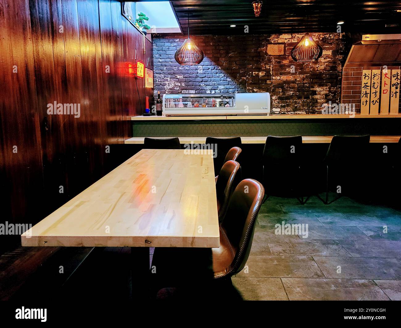 Modern Sushi Bar Interior with Communal Dining Table at Eye-Level ...