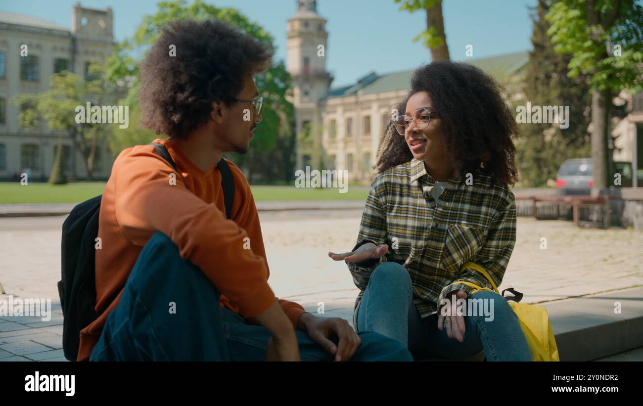 African American ethnic couple students people pupils classmates woman ...