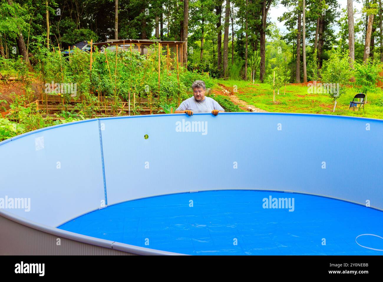 Installation of metal frame for above ground pool is currently in ...