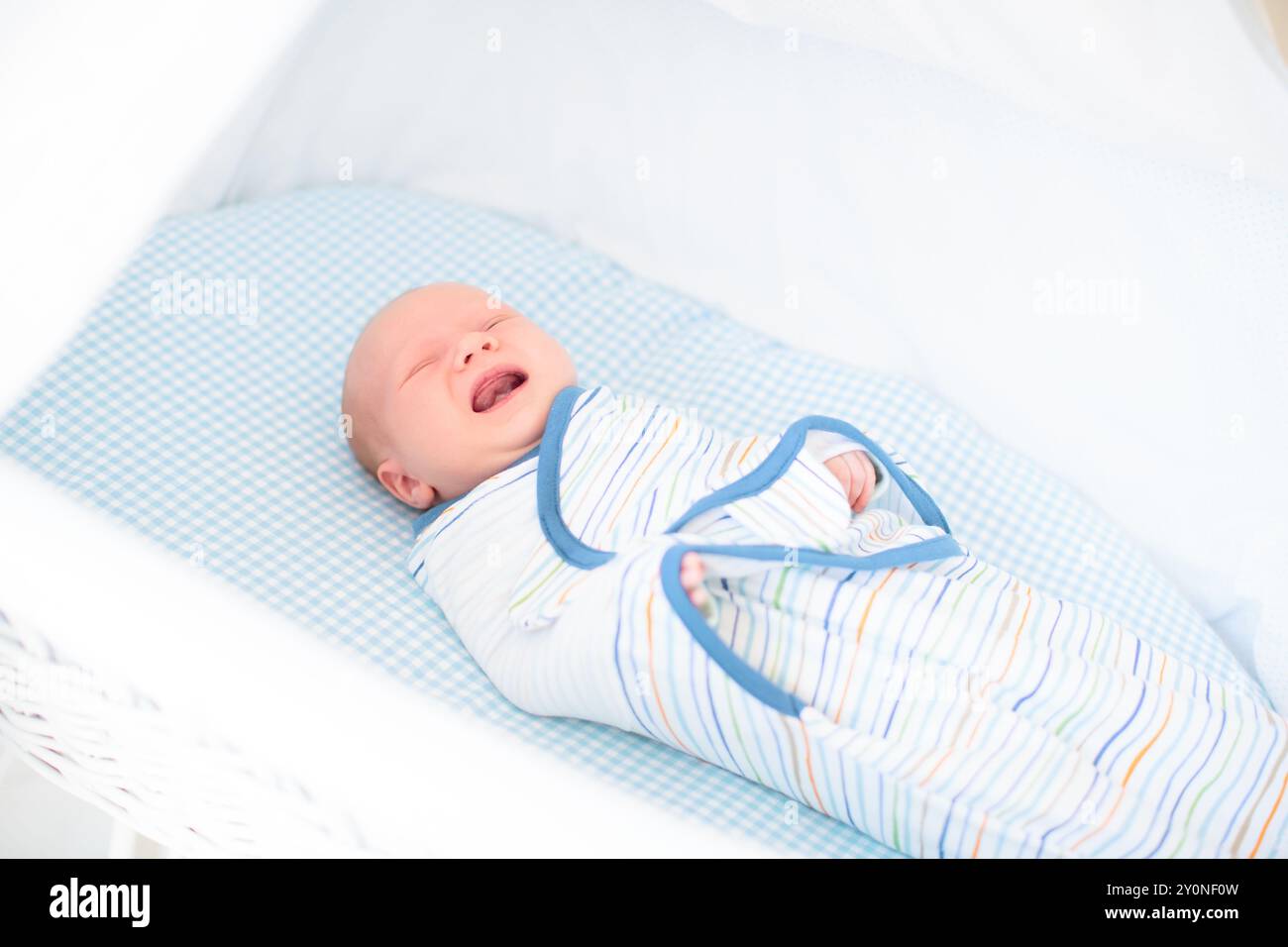 Swaddled baby crying hi-res stock photography and images - Alamy