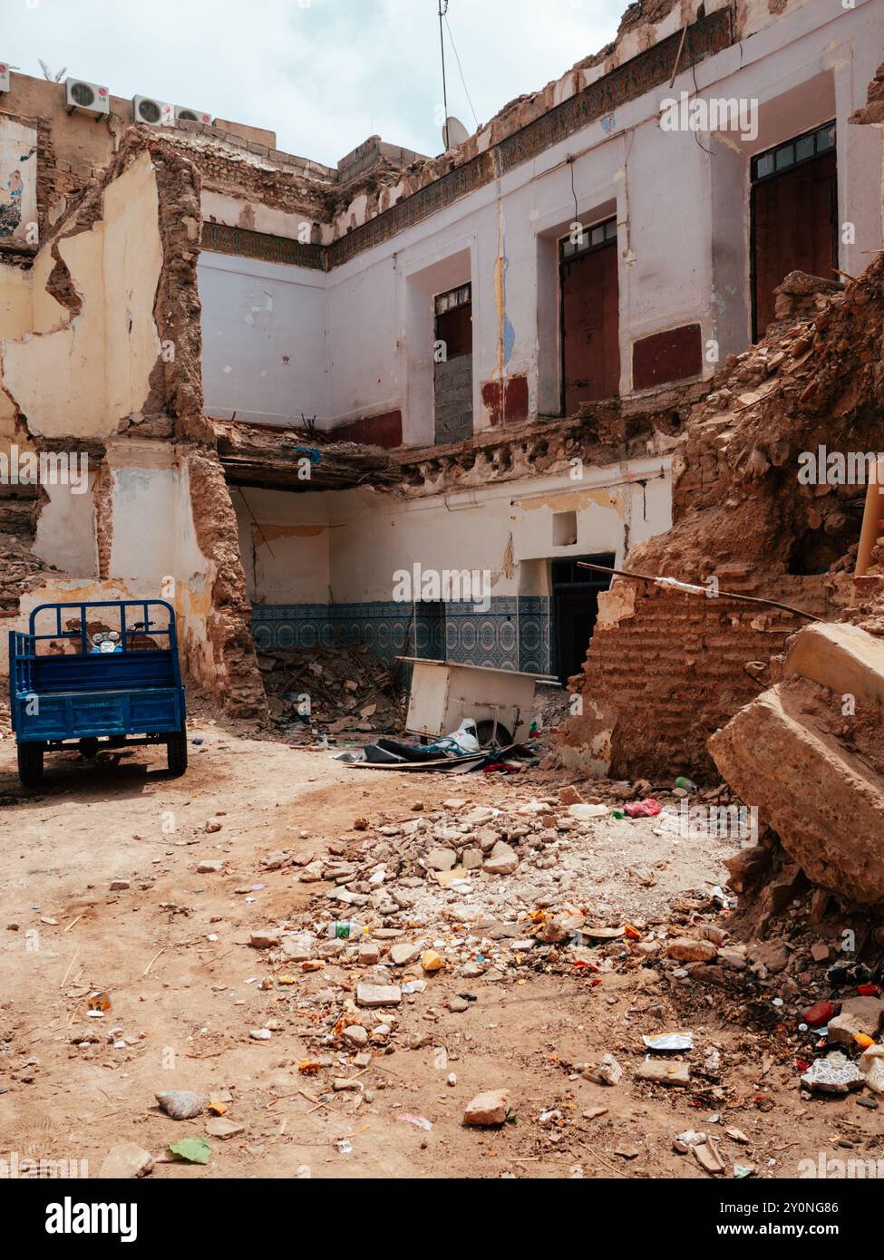 Crumbling walls of an abandoned building reveal a neglected interior ...