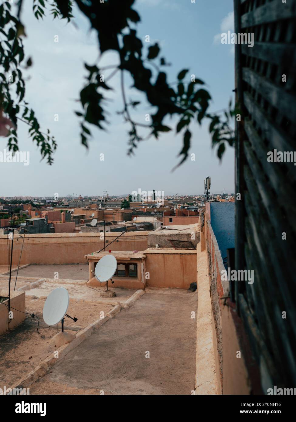 A rooftop perspective reveals a sprawling urban landscape filled with ...