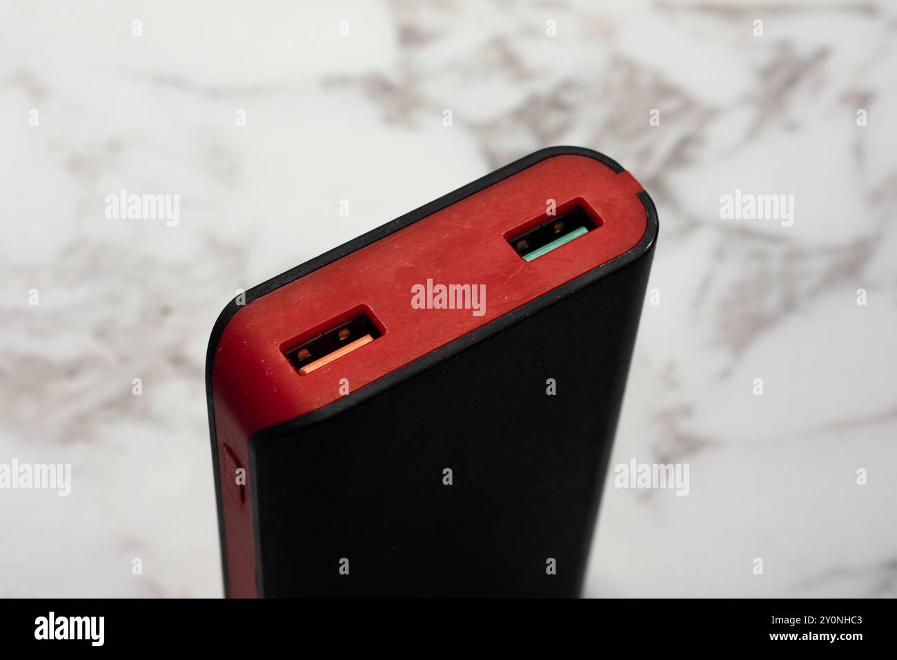 A modern power bank on a bright background, featuring a sleek design ...