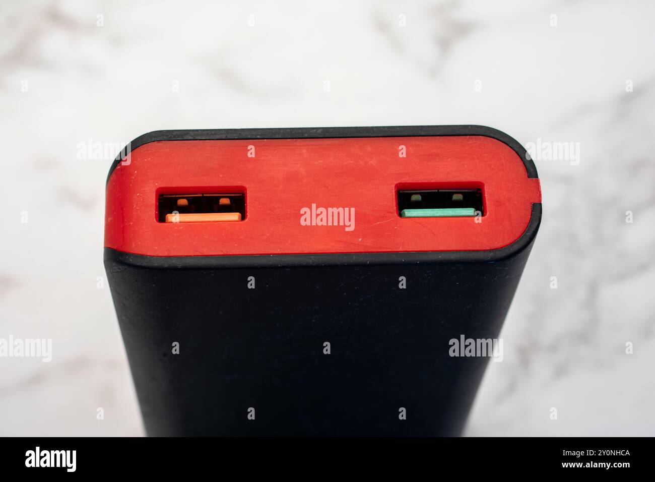 A modern power bank on a bright background, featuring a sleek design ...