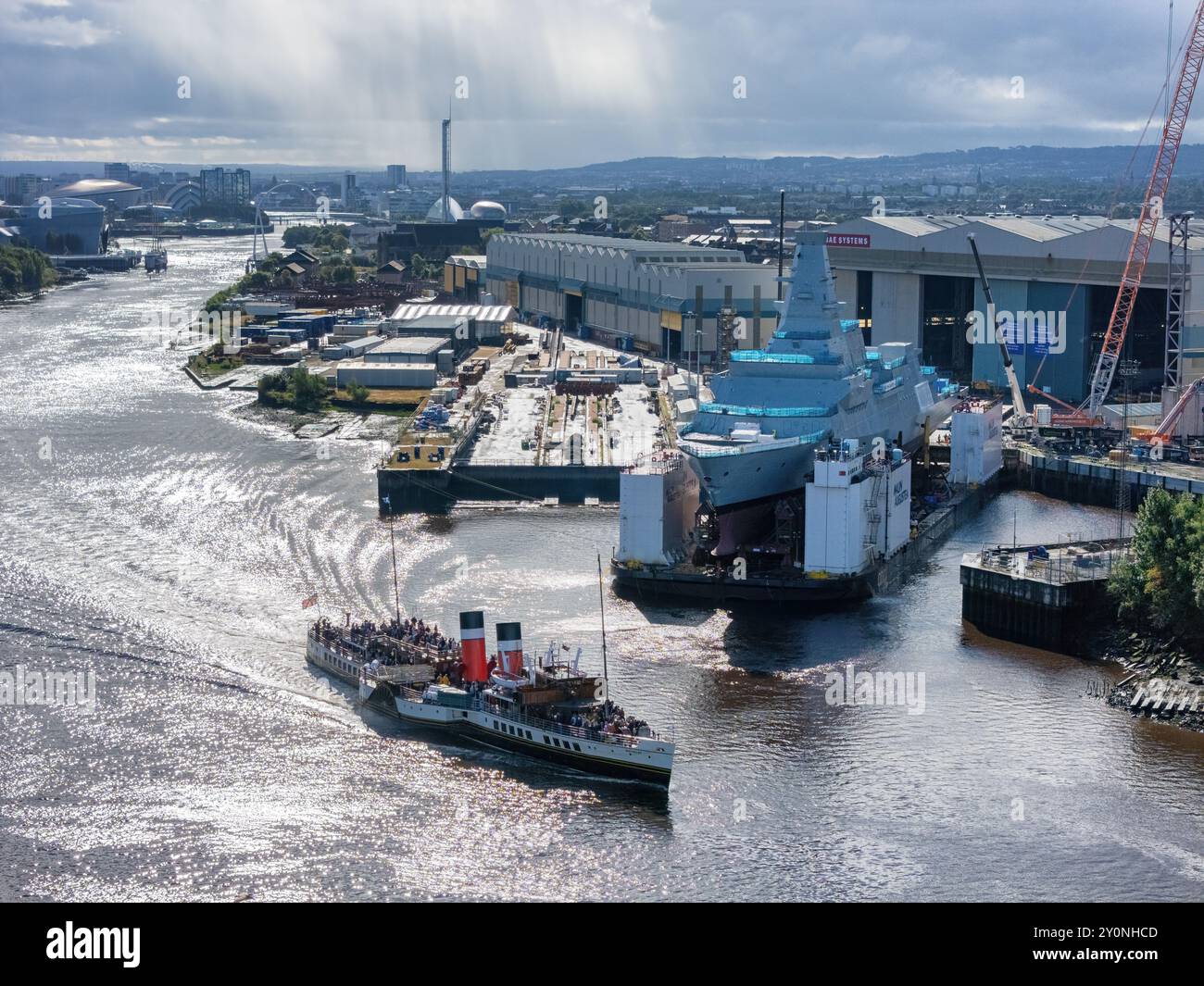 Contrasting generations of Clyde-built ships as Waverley (1947) sails past the future HMS ...