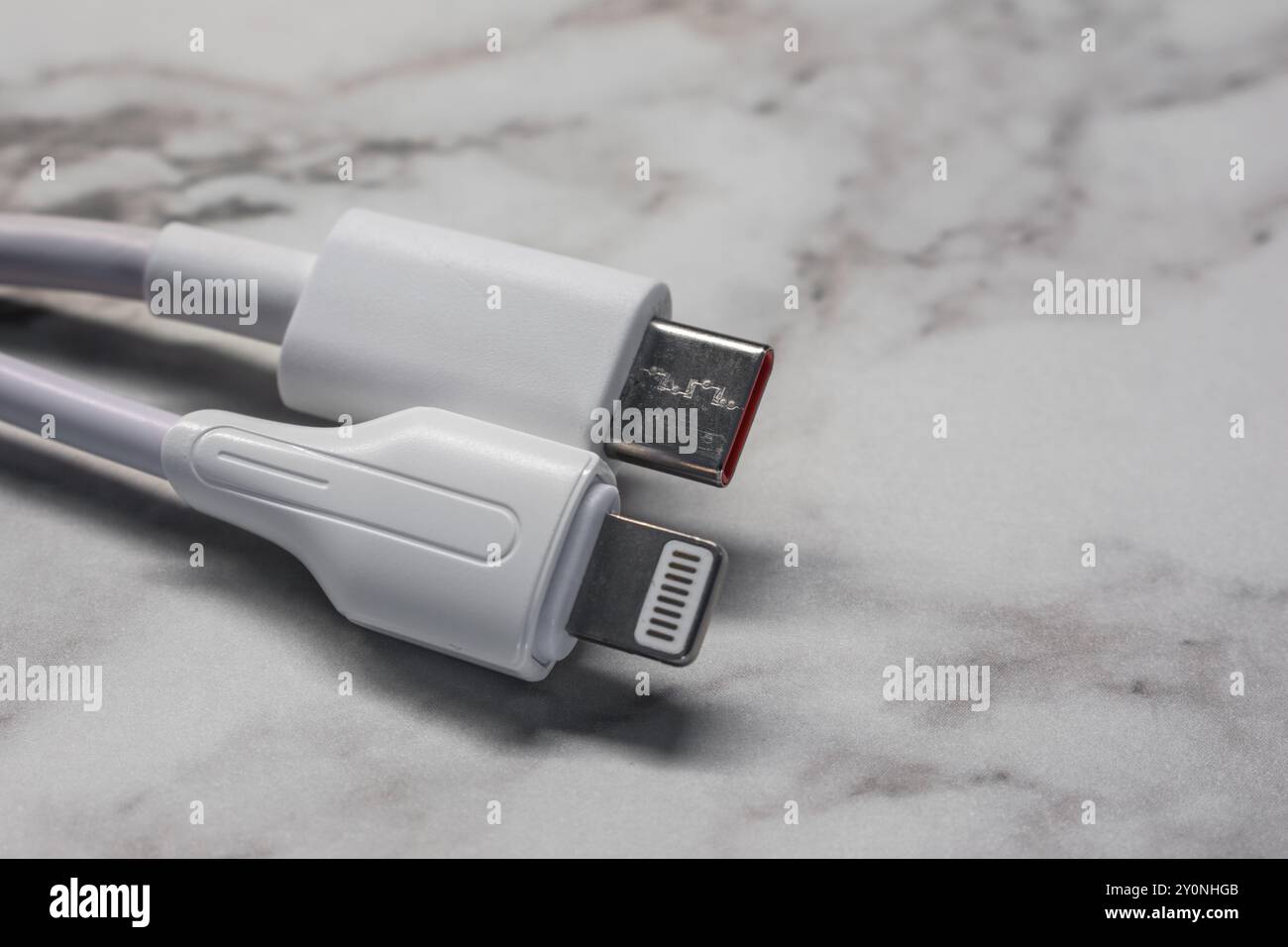 White charging and synchronization cables with Type-C and Lightning ...