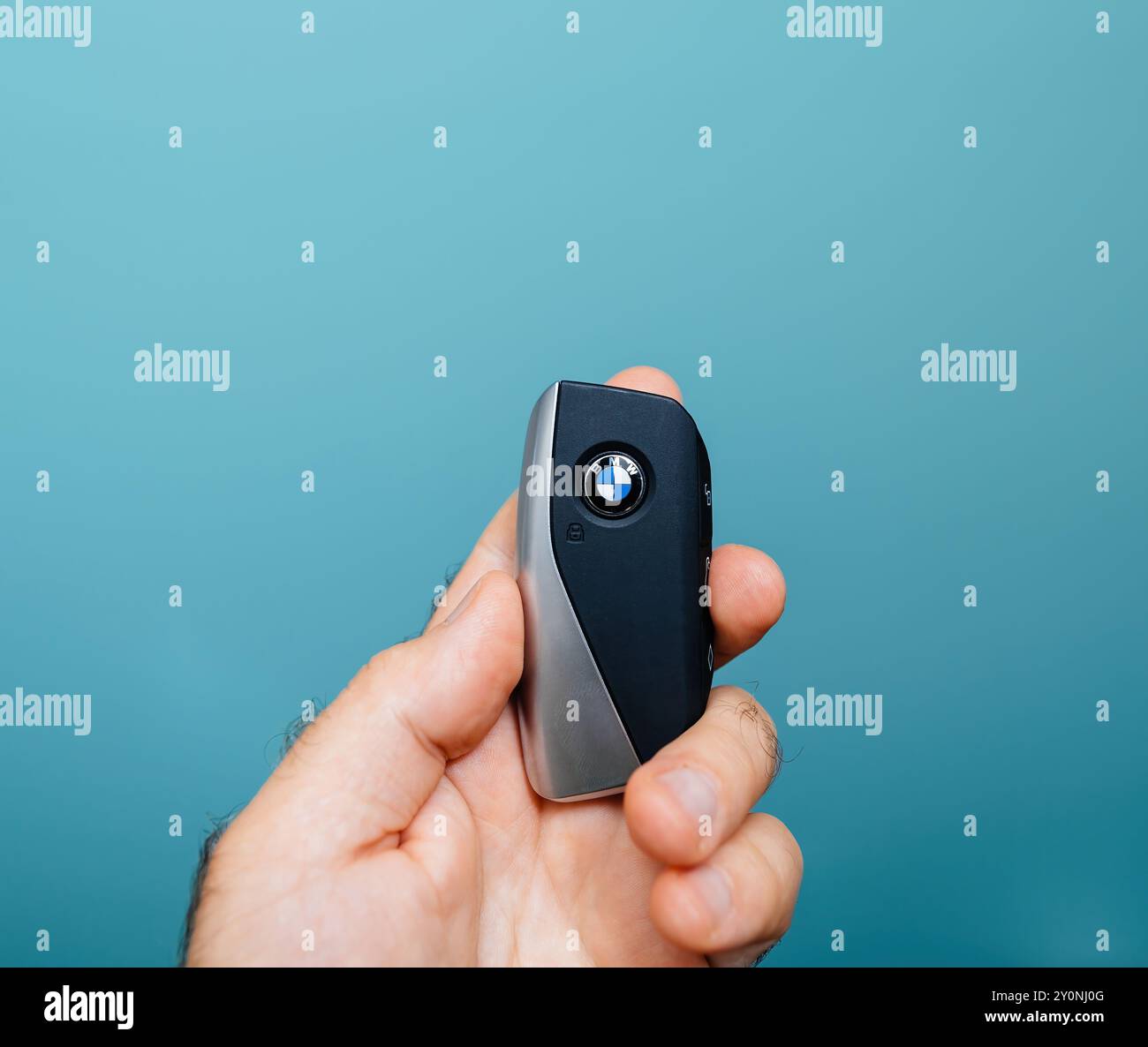 Munich, Germany - Sep 2, 2024: POV of a male hand holding the BMW ...
