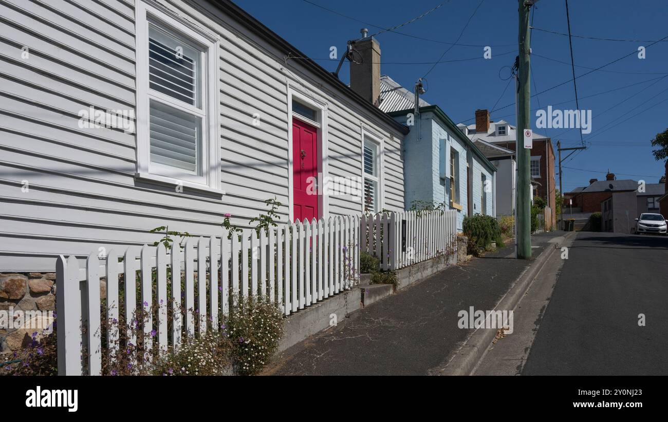 Row of houses along a roadway in the City of Hobart, capital of ...