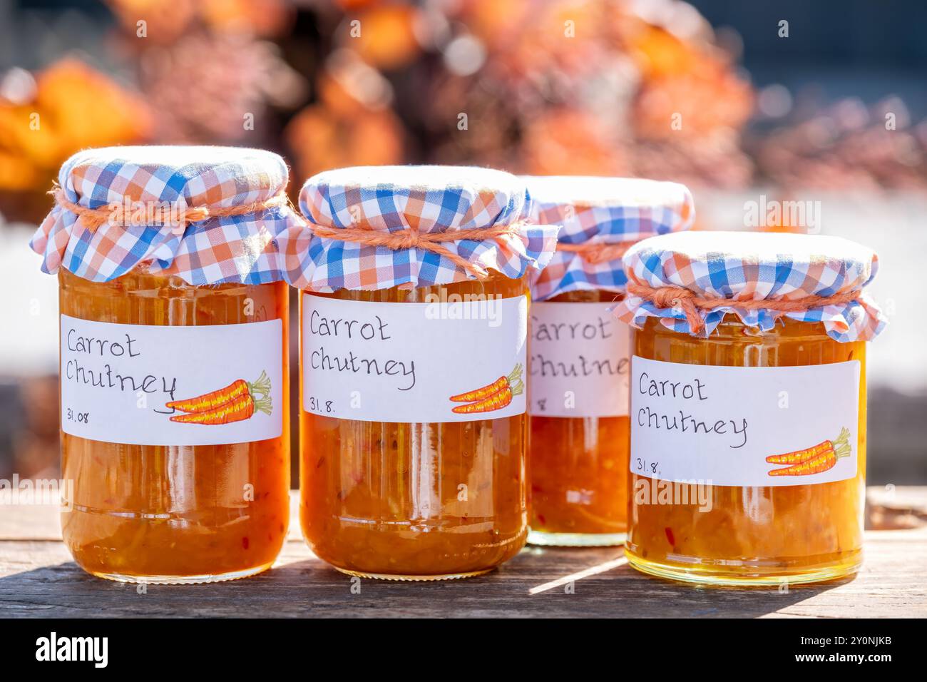 Uk. Homemade Carrot chutney stored in glass jars, labelled and finished ...