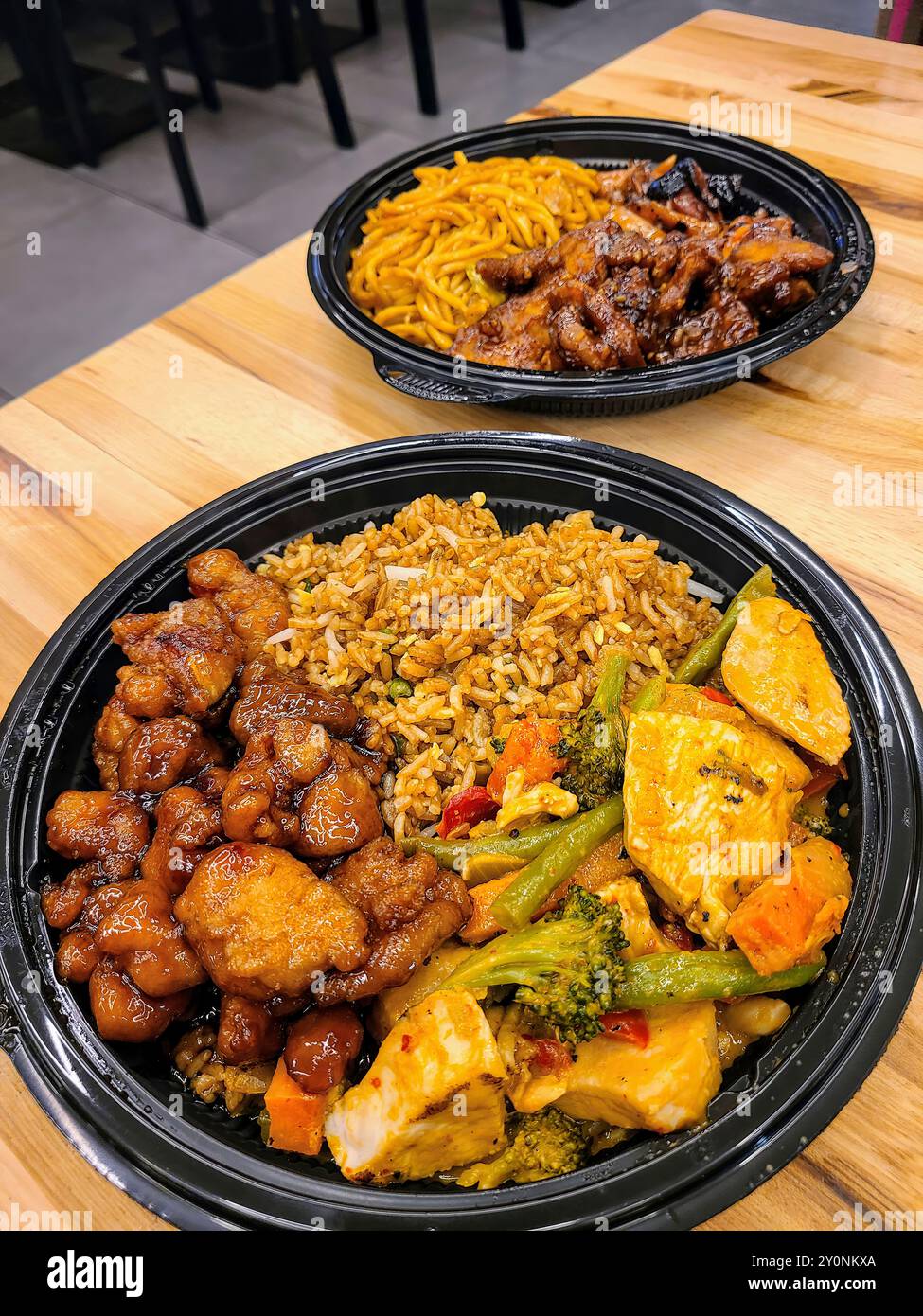 Asian Cuisine Plates with Fried Rice and Noodles at Eye Level Stock ...