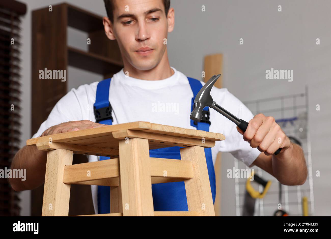 Professional repairman wooden stool hi-res stock photography and images ...
