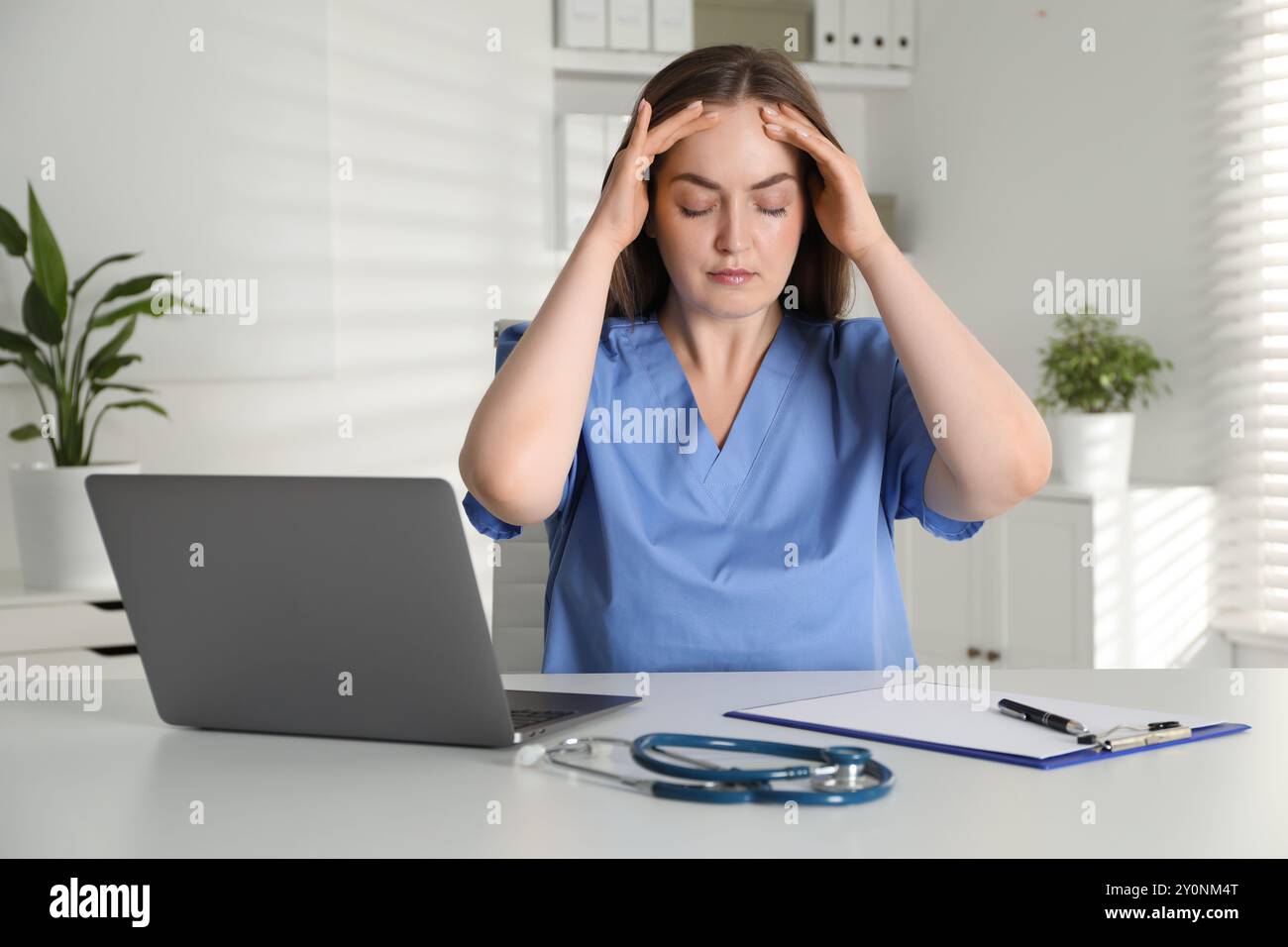 Tired specialist working in hi-res stock photography and images - Alamy