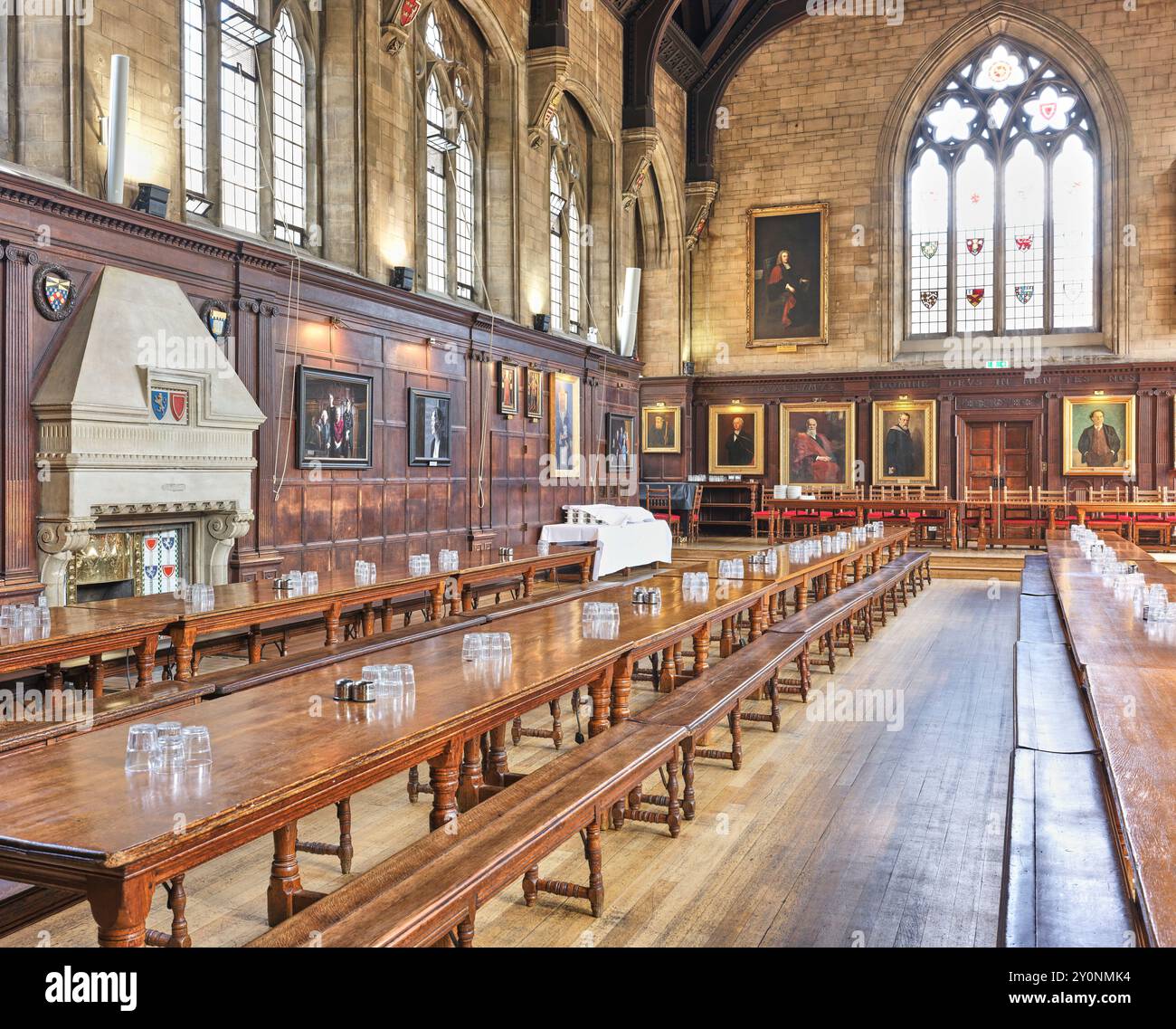 Long benches and tables in the Dining Hall at the University of Oxford ...